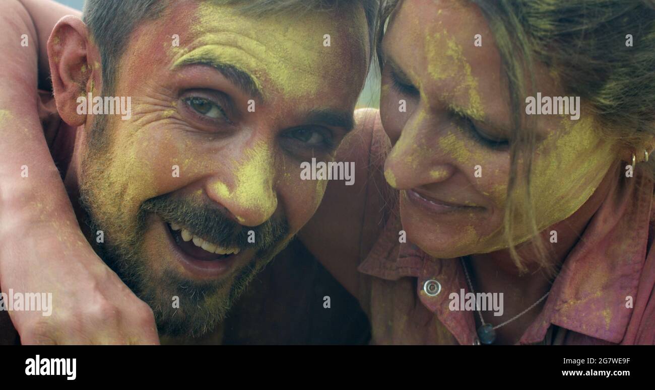 Happy couple with painted faces at the Holi Hindu festival of Color in ...