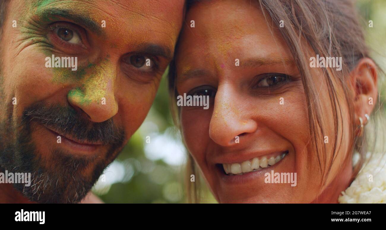 Happy couple with painted faces at the Holi Hindu festival of Color in ...