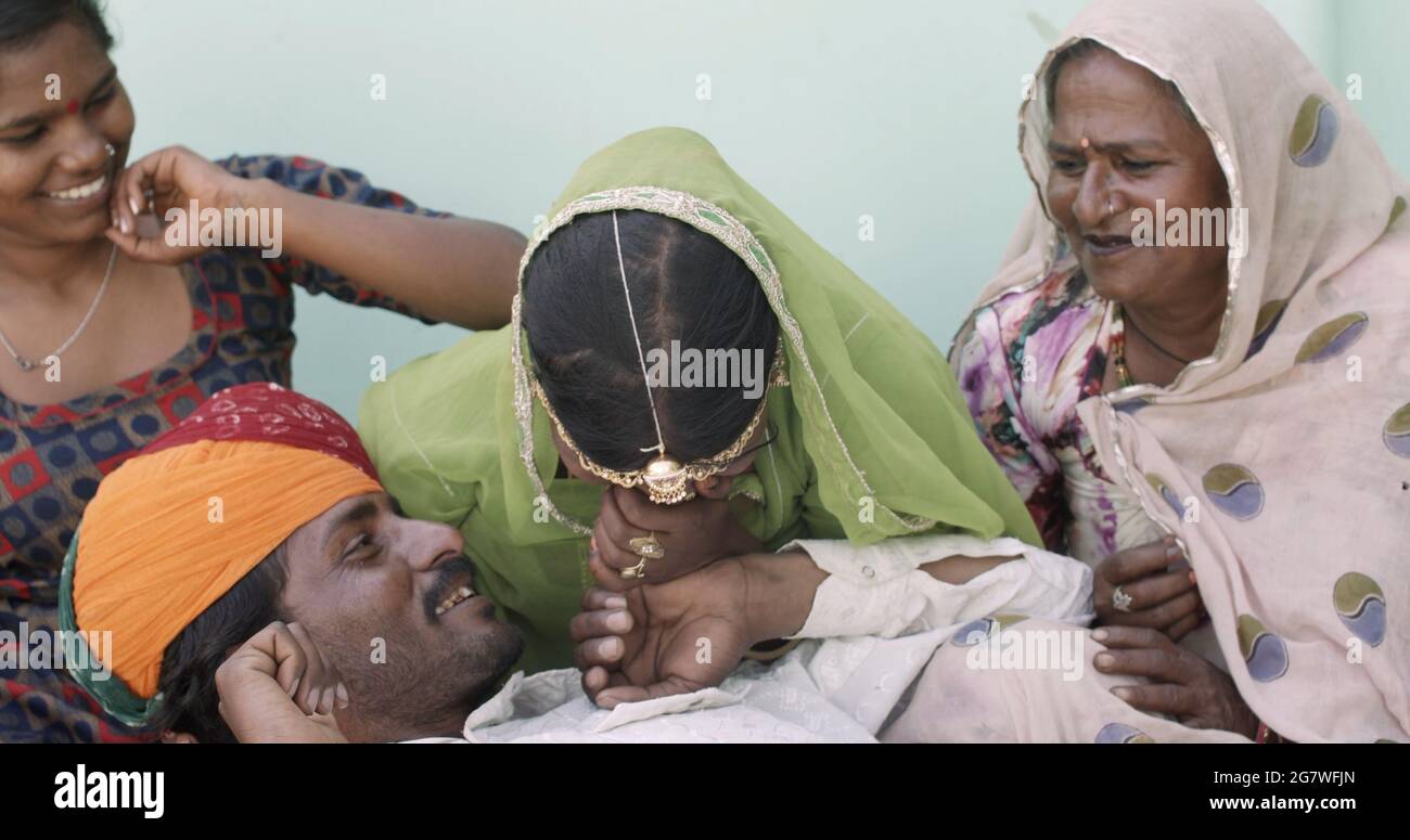 Group of South Asian people in traditional Indian clothing having fun ...