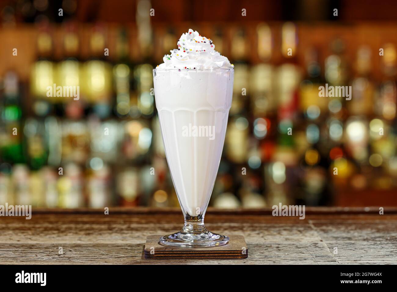 Milkshake in the cafe is on a blurry bar counter background Stock Photo ...