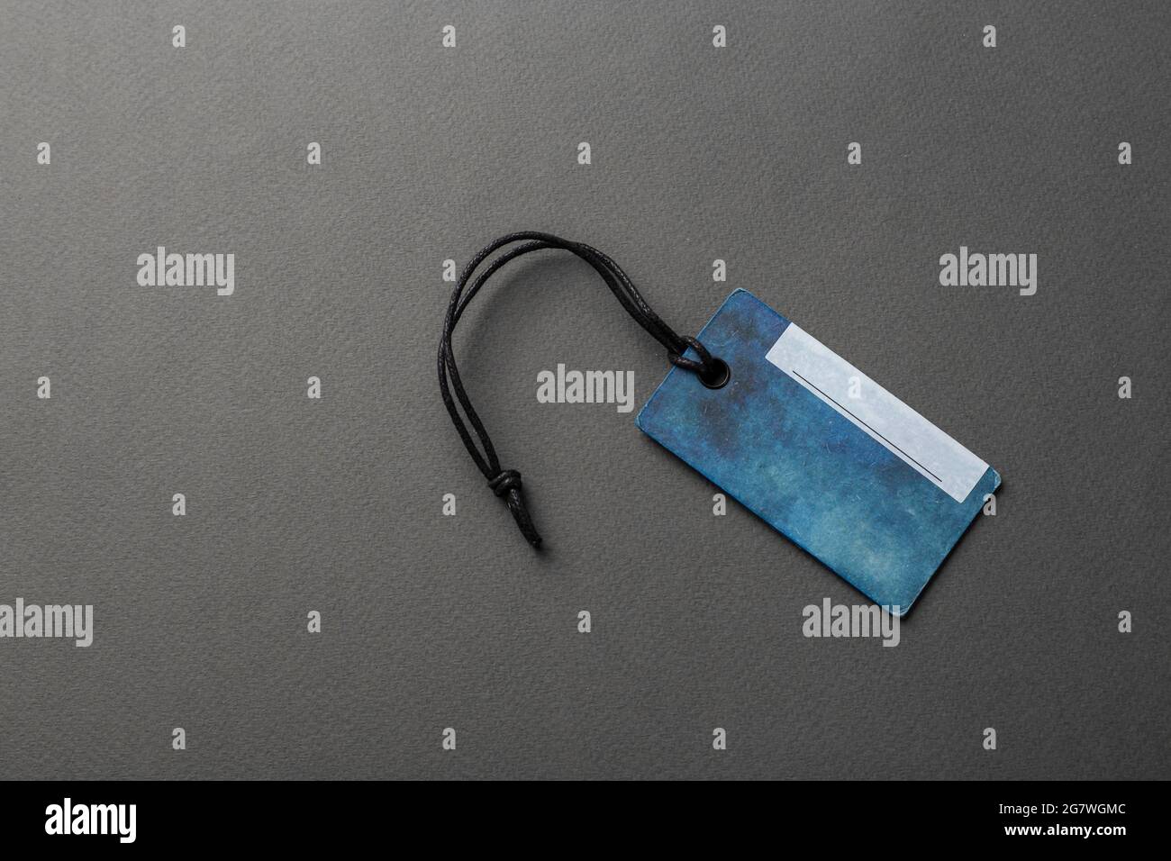 Blank tag tied with string. Price tag, gift tag, sale tag, address ...