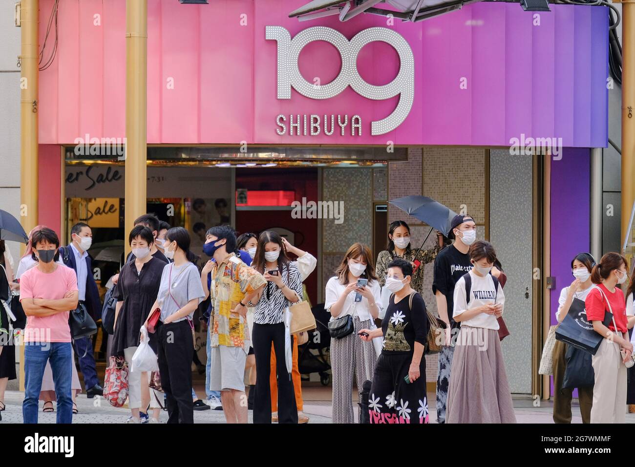 Tokyo, Japan. 15th July, 2021. Pedestrians wearing face masks as a ...