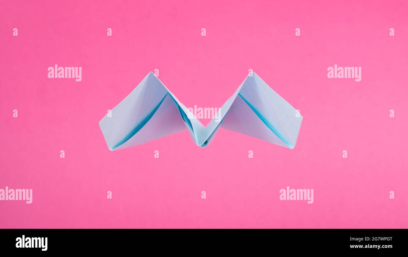 paper blue airplane on pink background back view, fly away Stock Photo ...