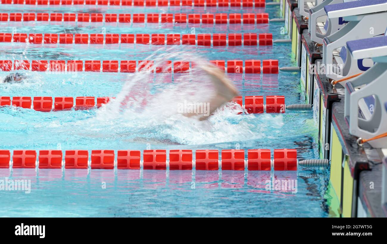 Young male swimming laps hi-res stock photography and images - Alamy