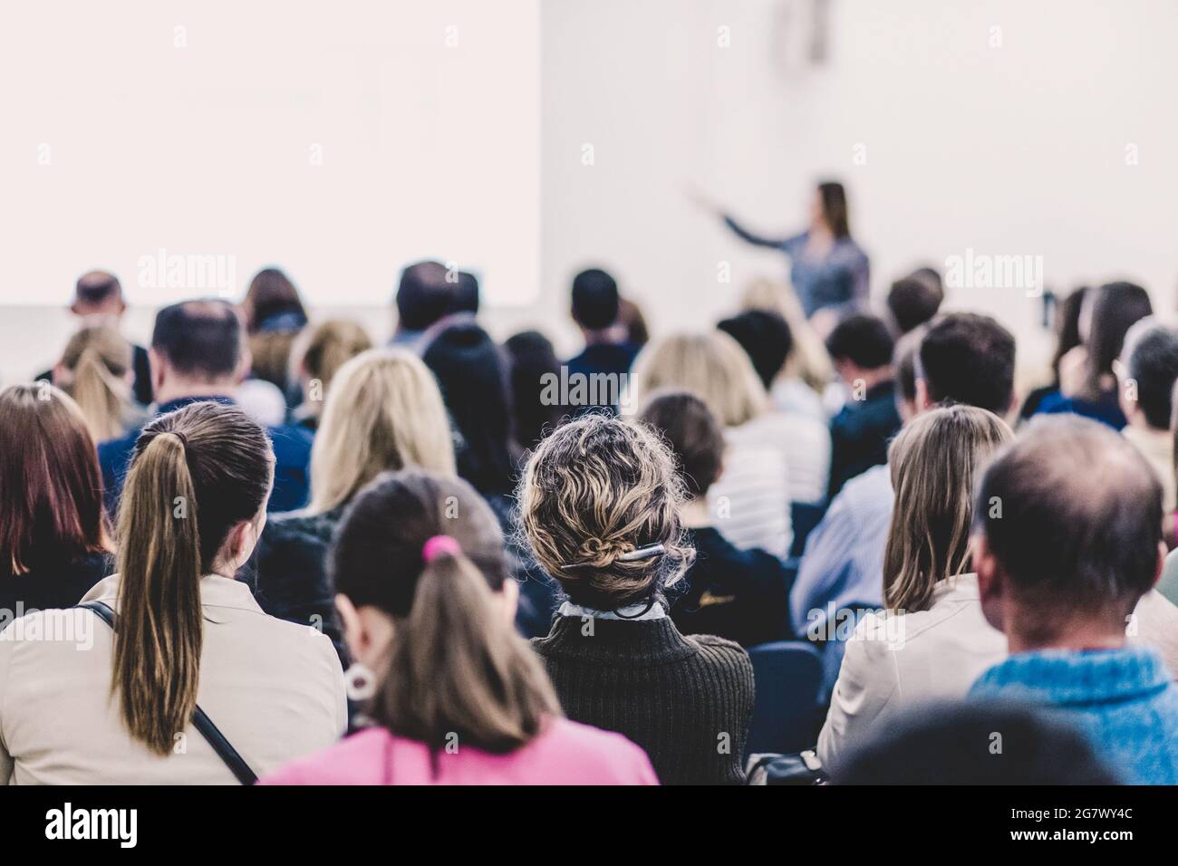 Woman giving presentation on business conference Stock Photo - Alamy
