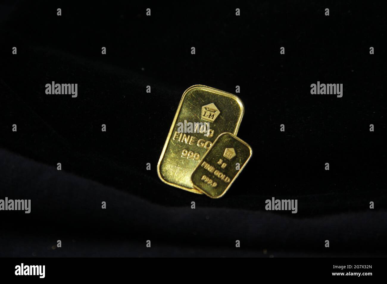 Fine gold bar (goldbar) on black background, produced by PT Aneka ...
