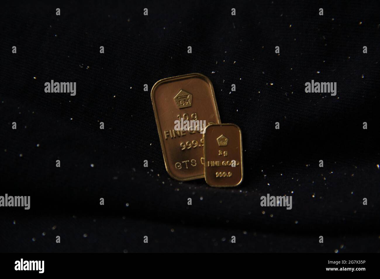 Fine gold bar (goldbar) on black background, produced by PT Aneka ...