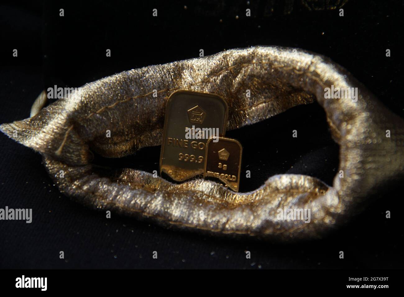 Fine gold bar (goldbar) on black background, produced by PT Aneka ...