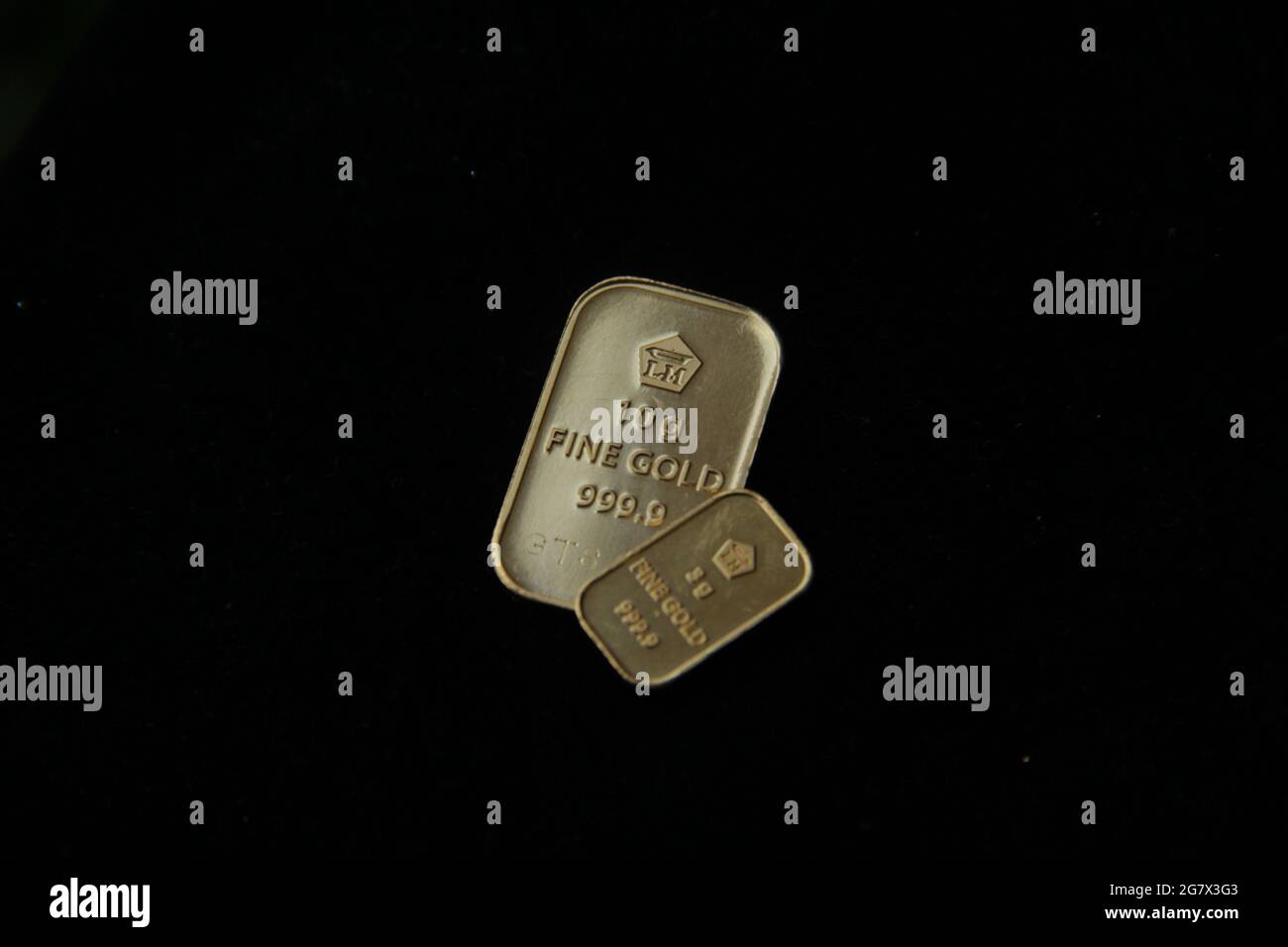 Fine gold bar (goldbar) on black background, produced by PT Aneka ...