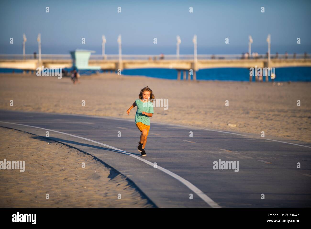 Boy kid running outdoor. Child are jump, run Stock Photo - Alamy