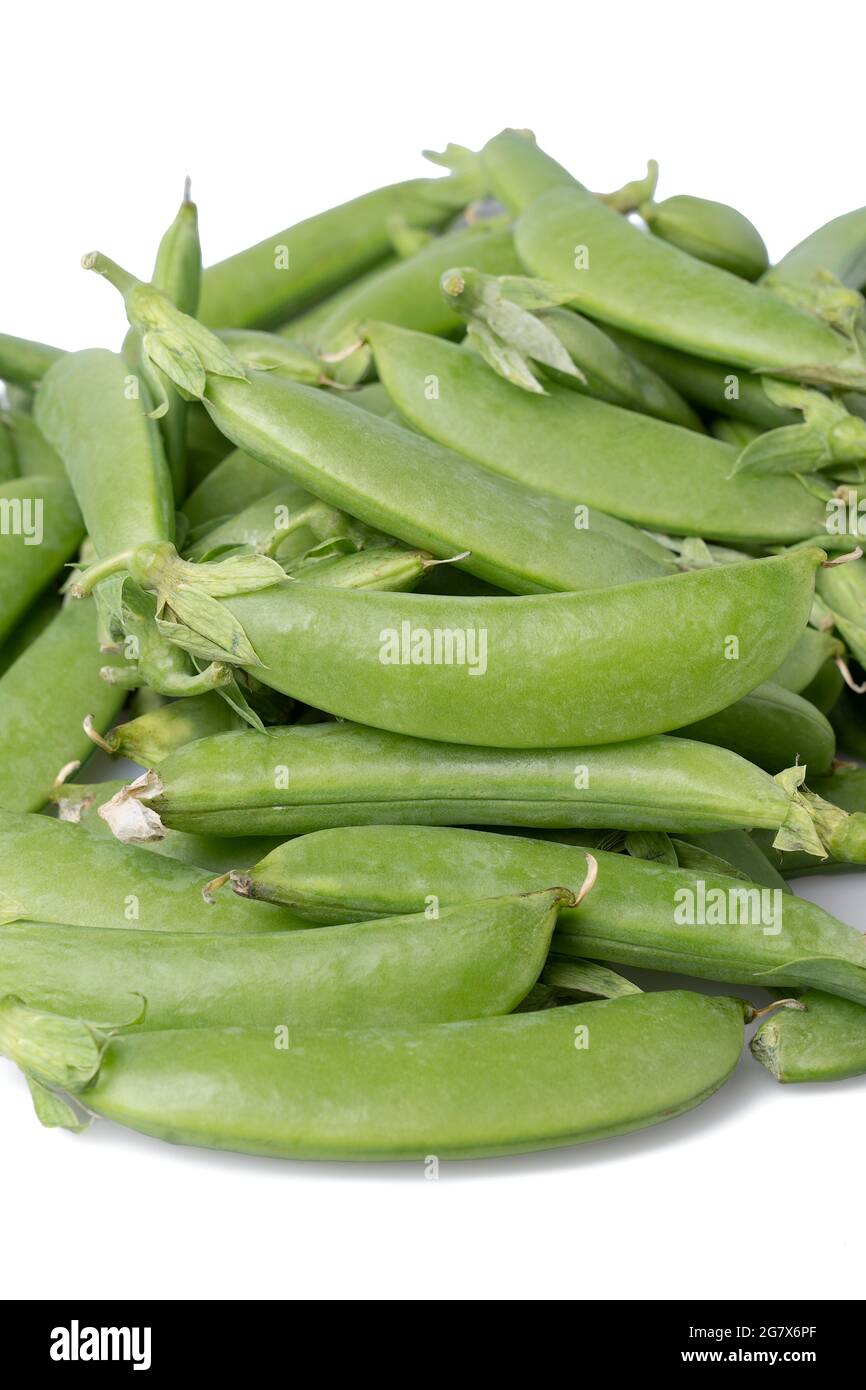 A pile of Sugar Snaps on a white table isolated Stock Photo - Alamy