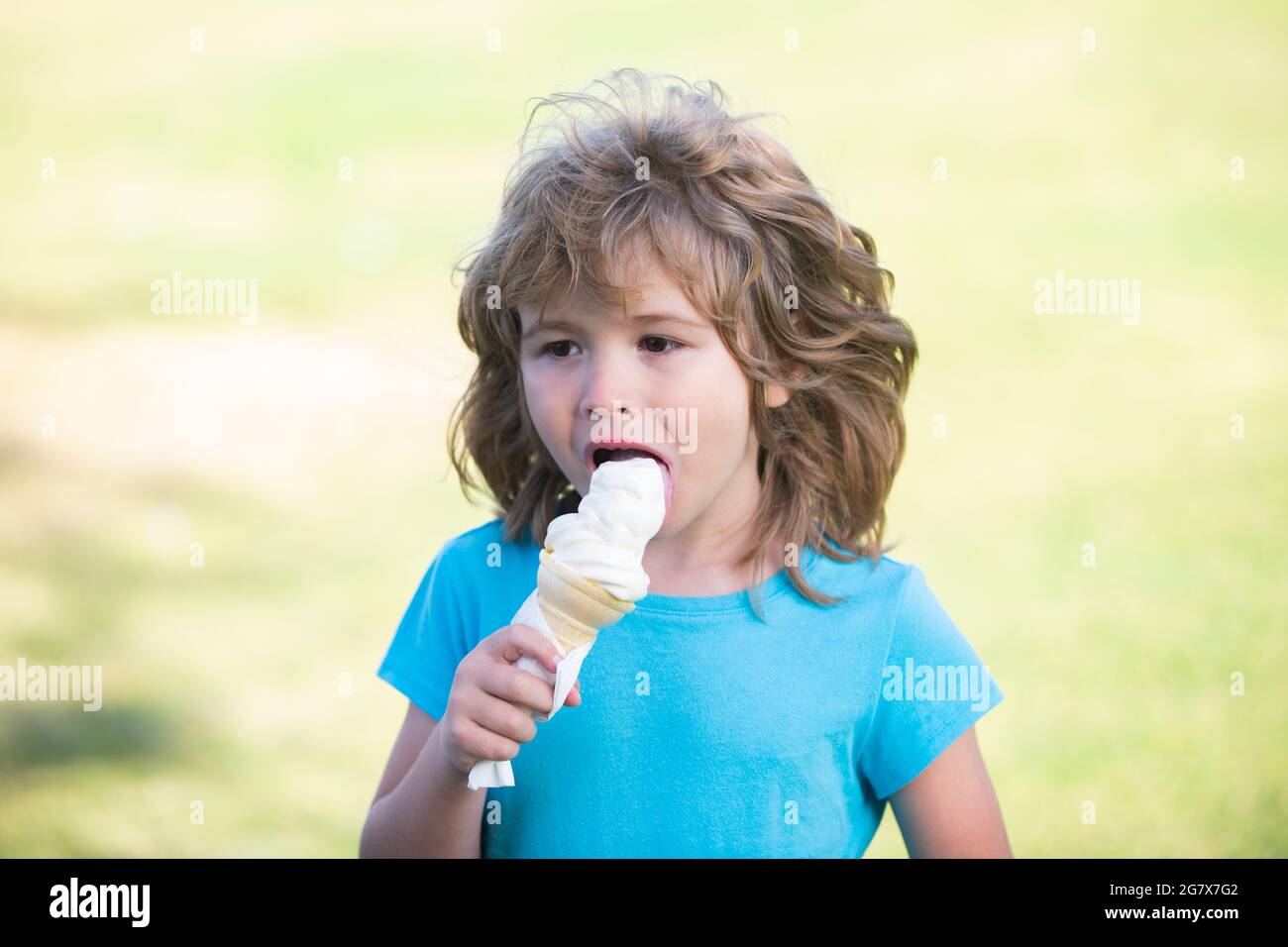 Funny child eating icecream, face close up. Kids head portrait Stock ...