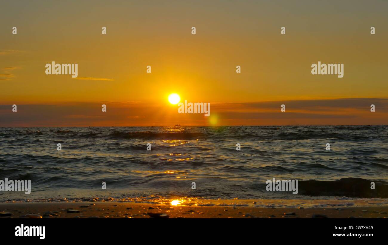 Colorful beach sunrise and sun rays, calmness tranquil relaxing ...