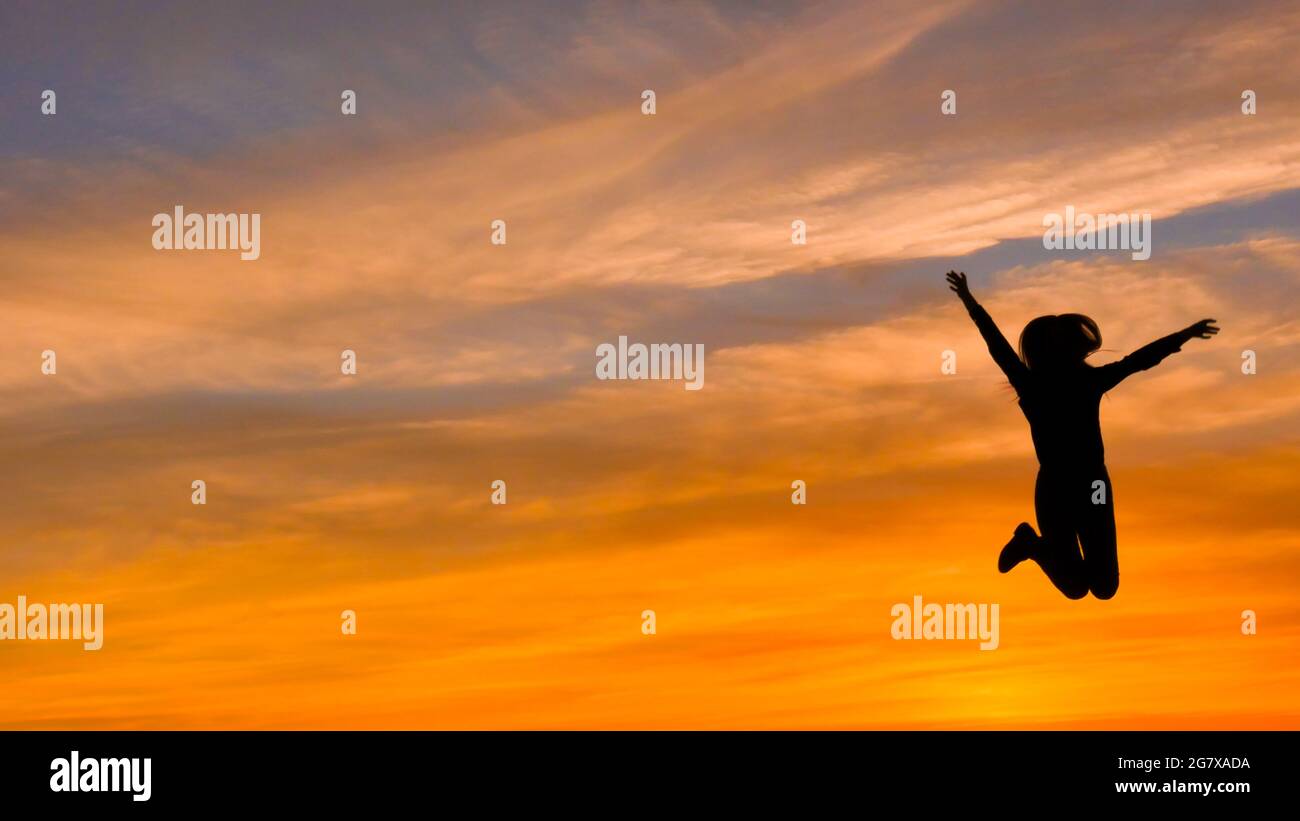 Silhouette Excited Woman Jumping Sunset High Resolution Stock ...