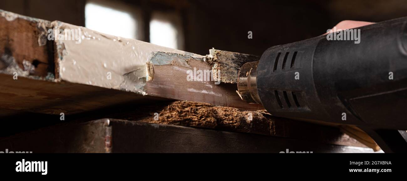 removing old paint from old wooden doors with a spatula and a heat gun ...