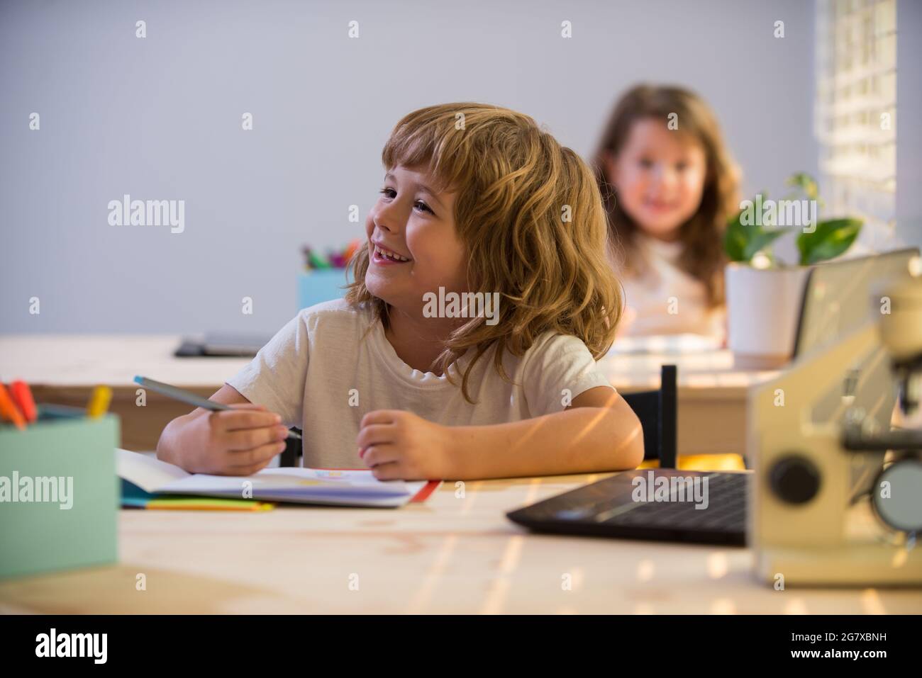 School kid doing homework. Pupil gets ready for school. Portrait of ...