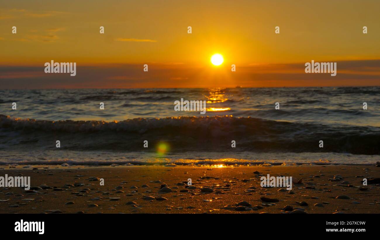Colorful beach sunrise and sun rays, calmness tranquil relaxing ...
