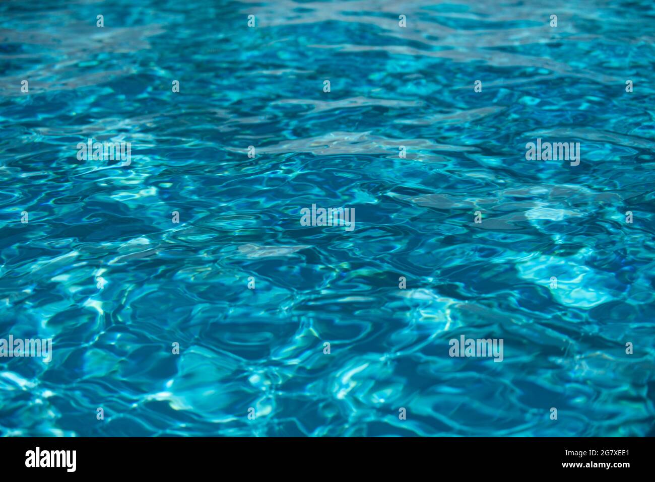 Abstract ripple wave and clear turquoise water surface in swimming pool ...