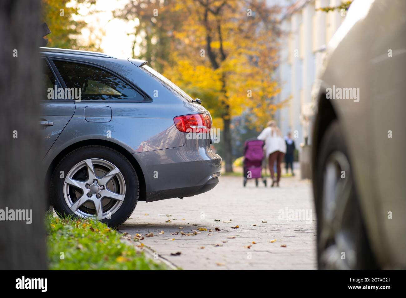 New clean car parked on a city street side Stock Photo - Alamy