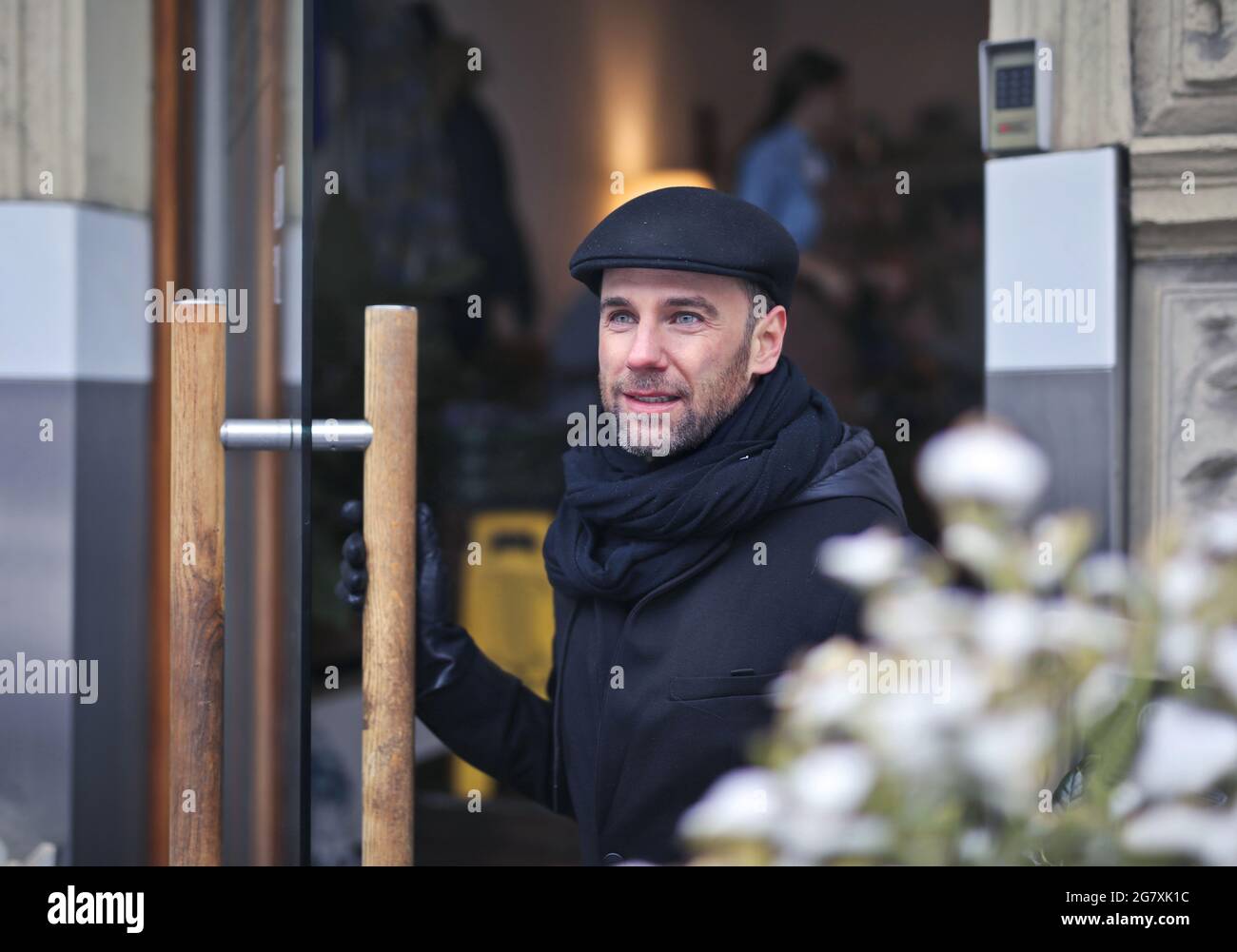Man walking out of a shop door hi-res stock photography and images - Alamy
