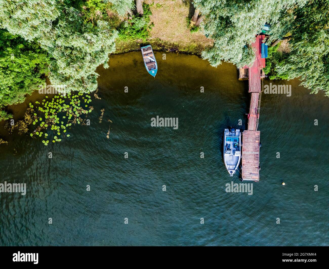 Aerial drone view of boats that stand by the water on the river in ...