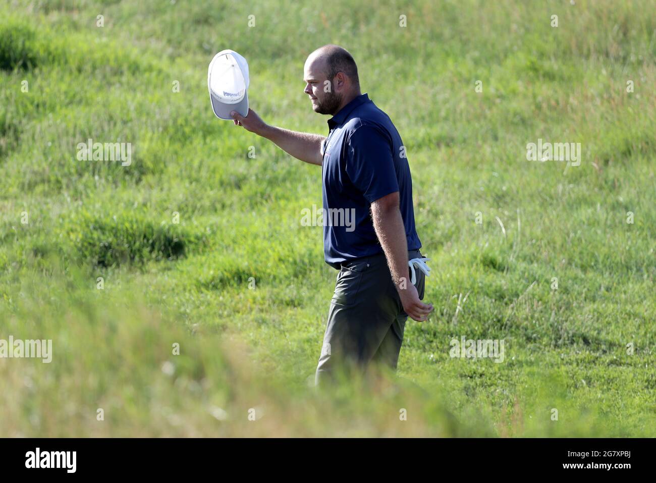 England's Jon Thomson celebrates a hole in one on the 16th green during ...