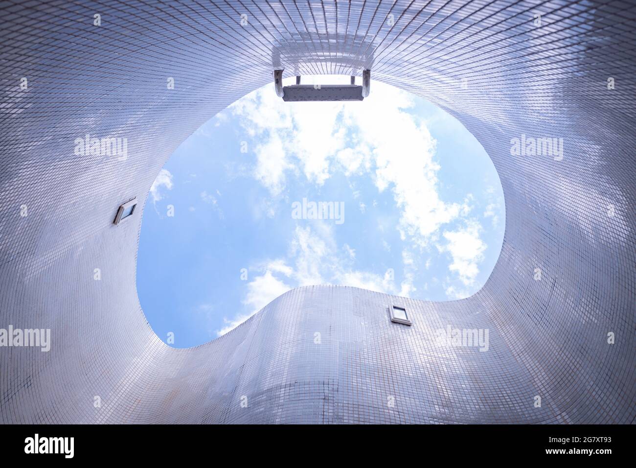 Sky seen from the bottom of an empty oval pool, concept of artistic ...
