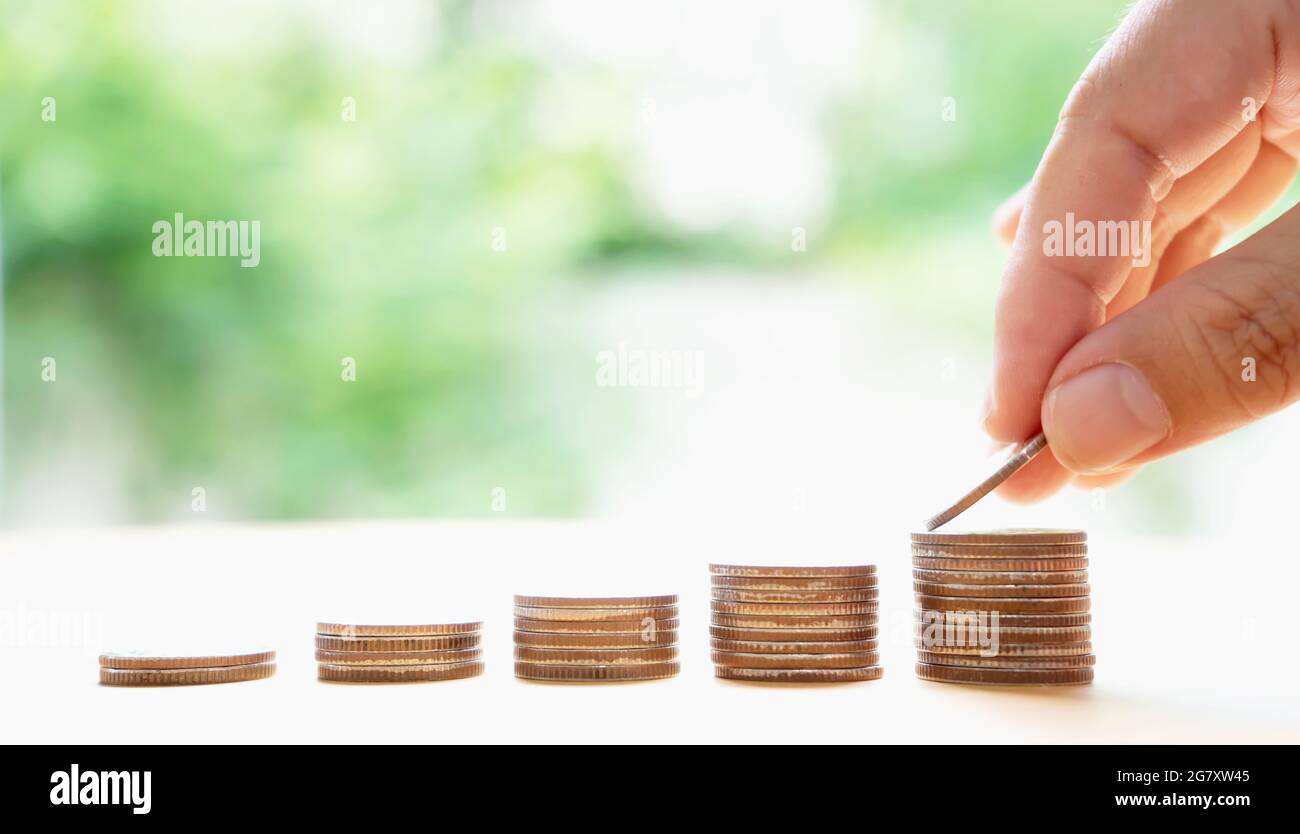Close up hand giving coins hi-res stock photography and images - Alamy