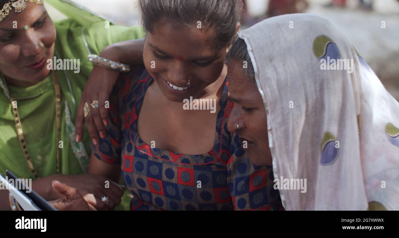Group of happy Indian women cheerfully chatting during the video call ...