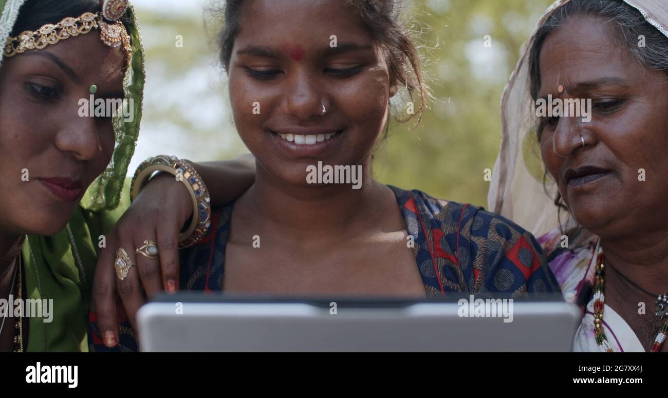 Indian women having a video call using a tablet Stock Photo - Alamy