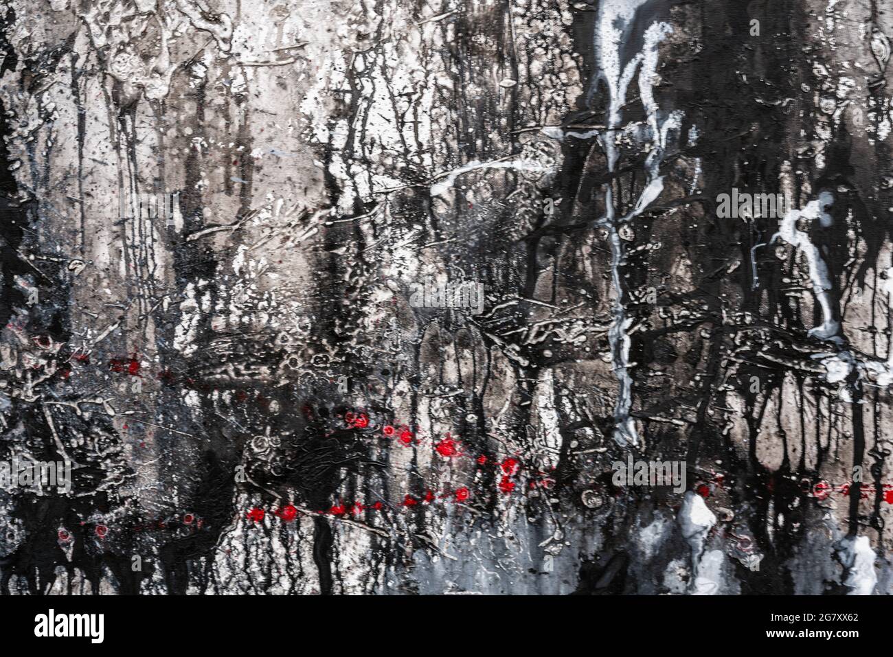 Closeup of black color paint splash with red dots on the white ...