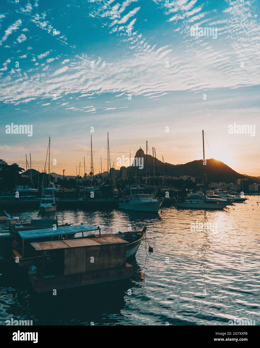 Boats floating in a sea during the sunset in Rio de Janeiro Stock Photo ...