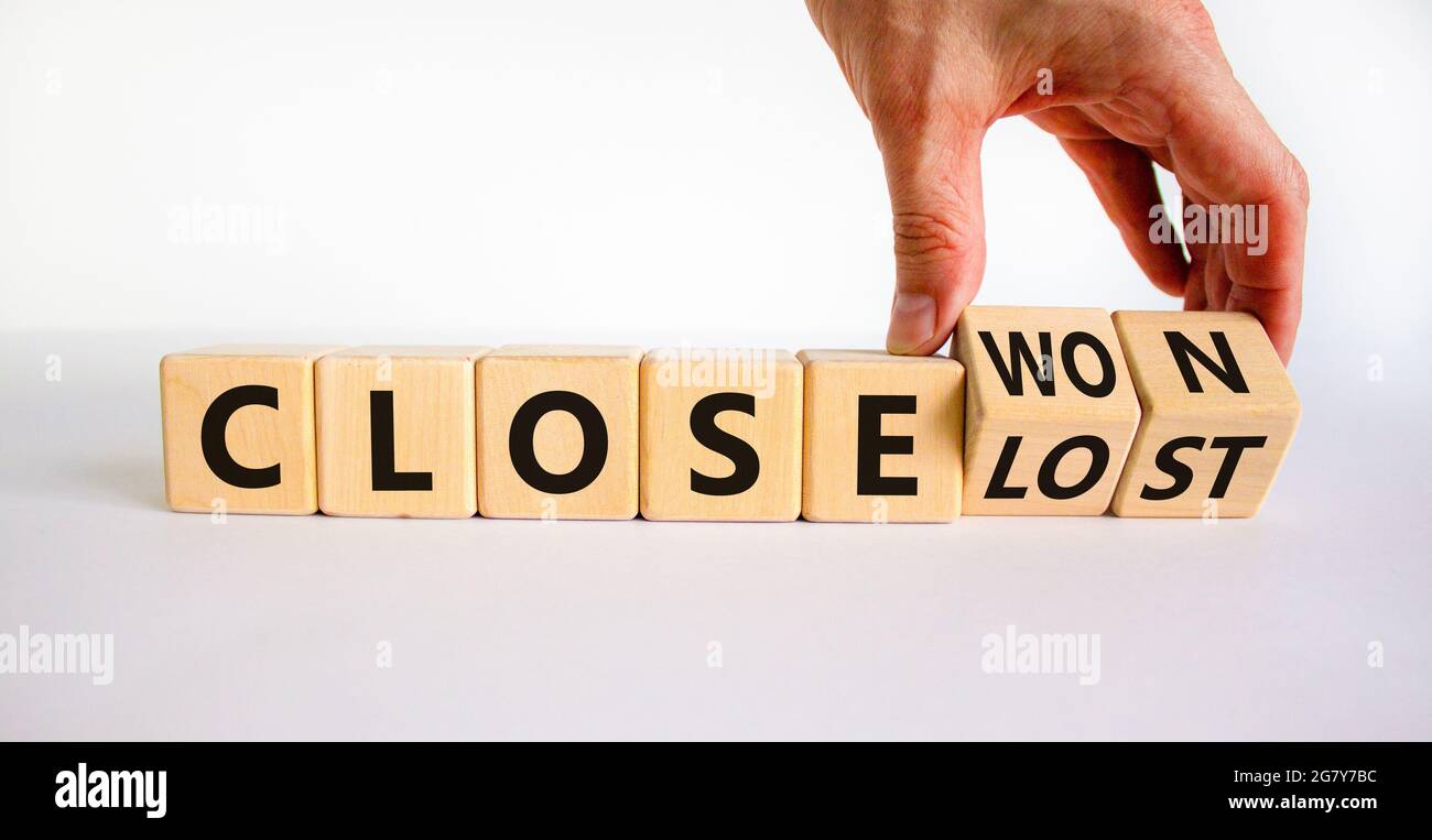Close won or lost symbol. Businessman turns wooden cubes and changes ...