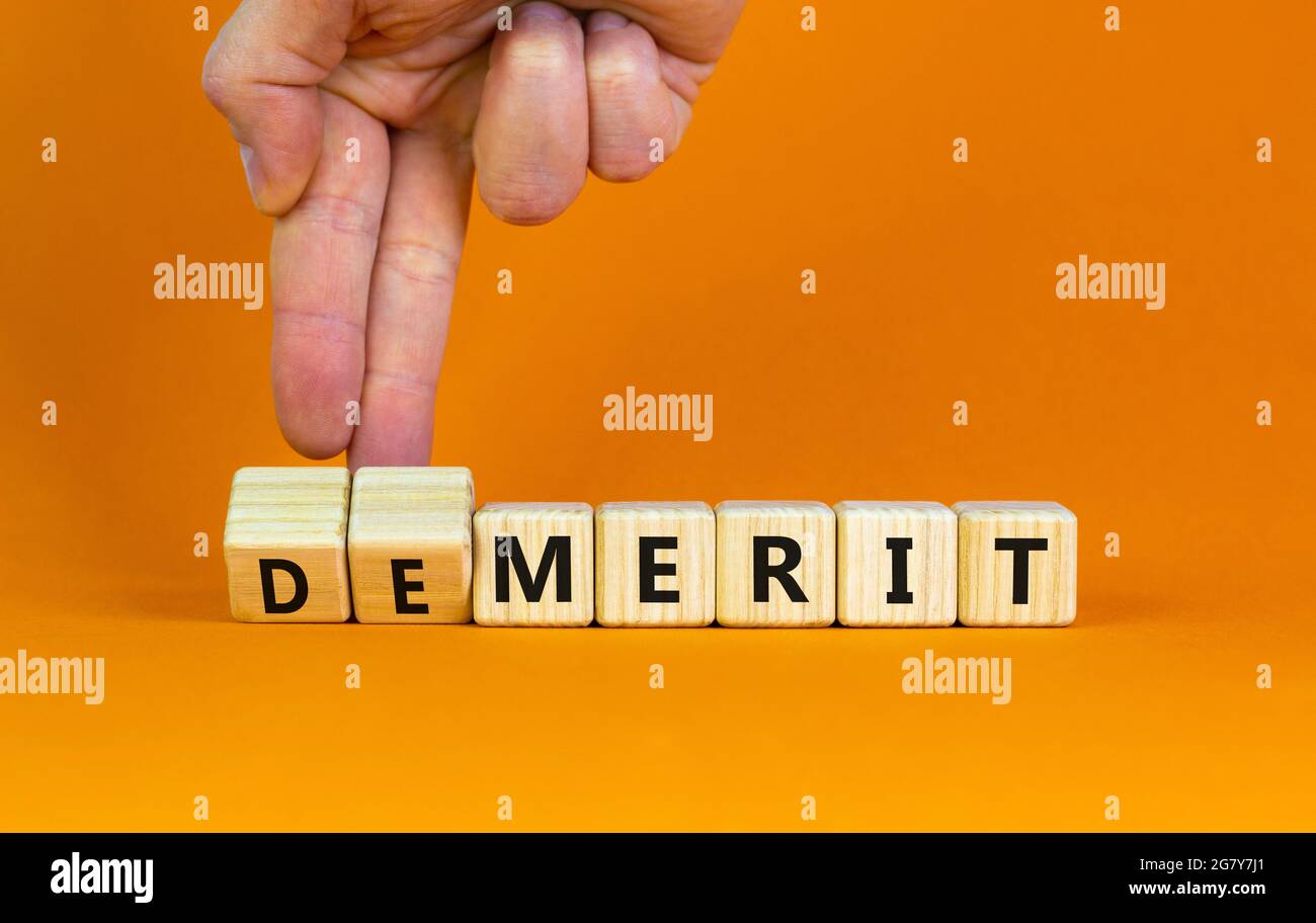Demerit or merit symbol. Businessman turns wooden cubes and changes ...