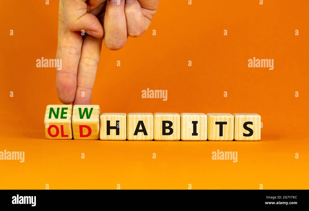 New or old habits symbol. Businessman turns wooden cubes and changes ...