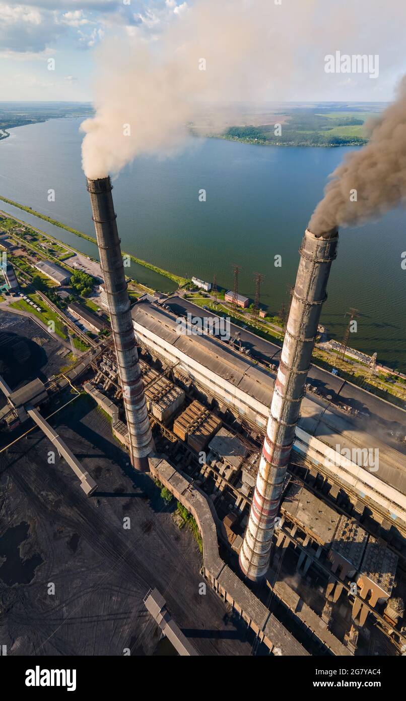 Aerial view of coal power plant high pipes with black smokestack ...