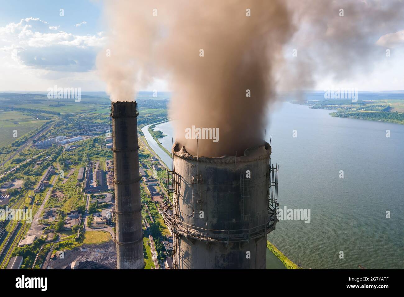 Aerial view of coal power plant high pipes with black smokestack ...