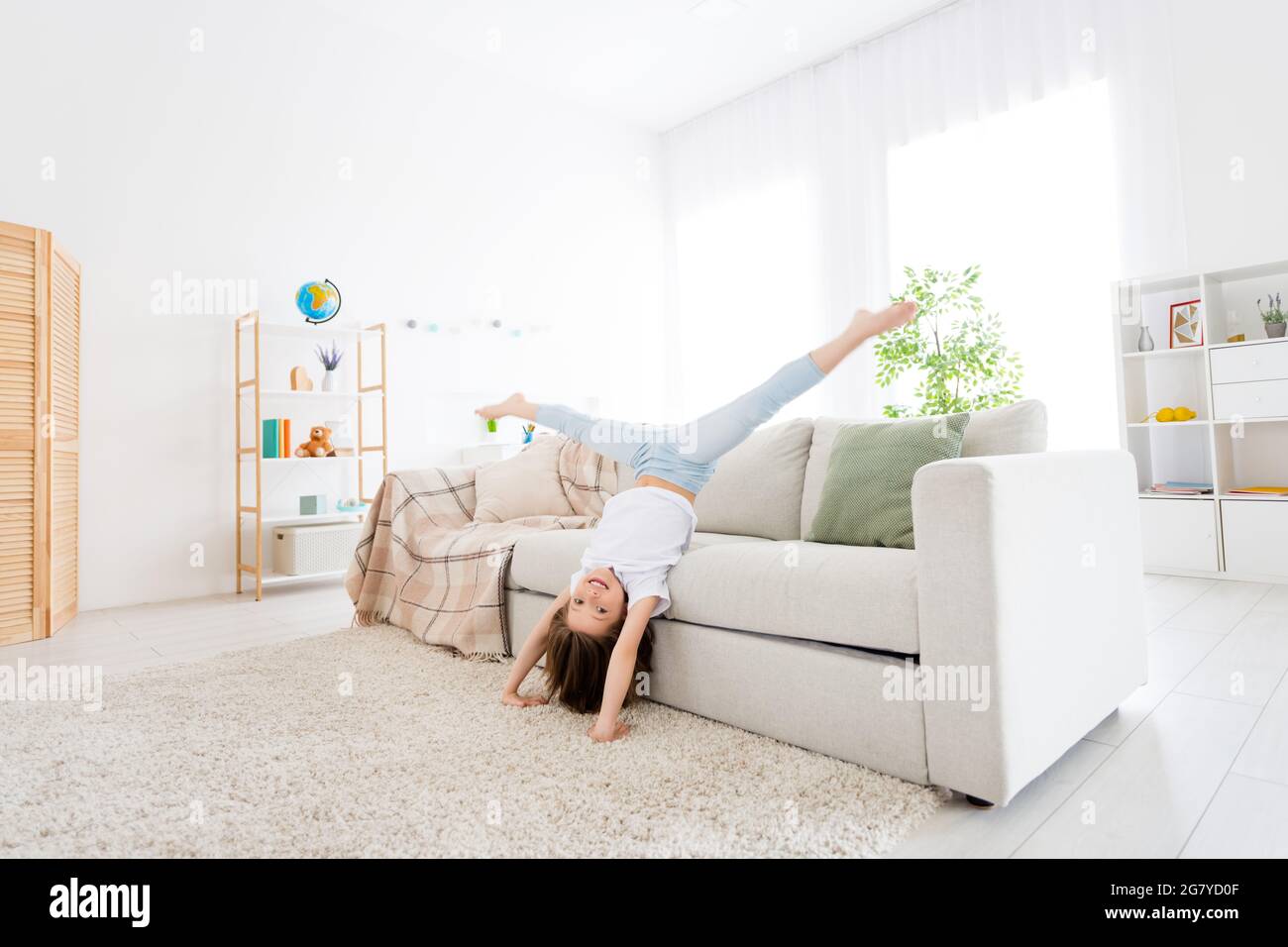 Full length photo of young little girl happy positive smile have fun ...