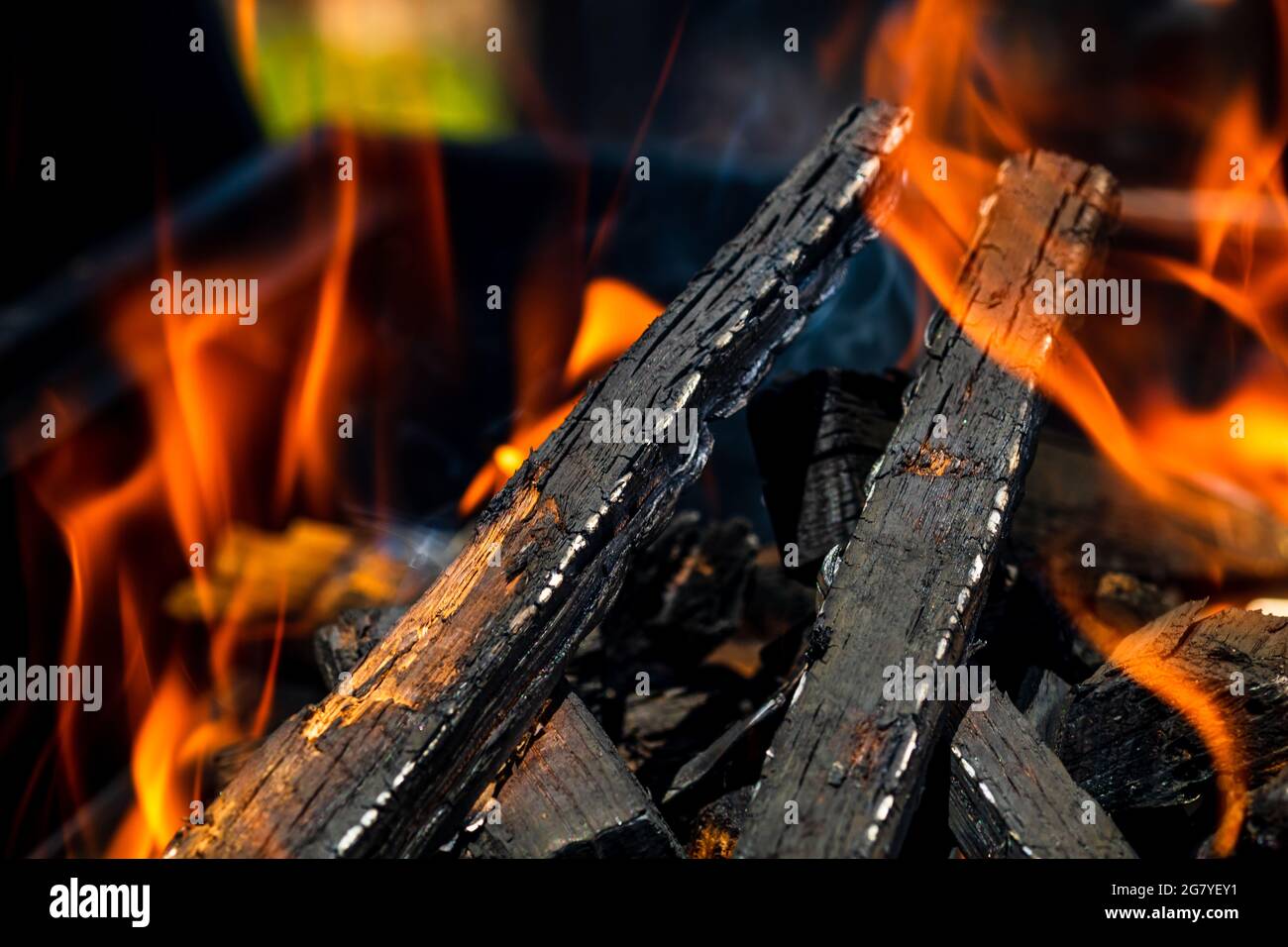 Barbecue grill pit with glowing and flaming hot open fire with red ...