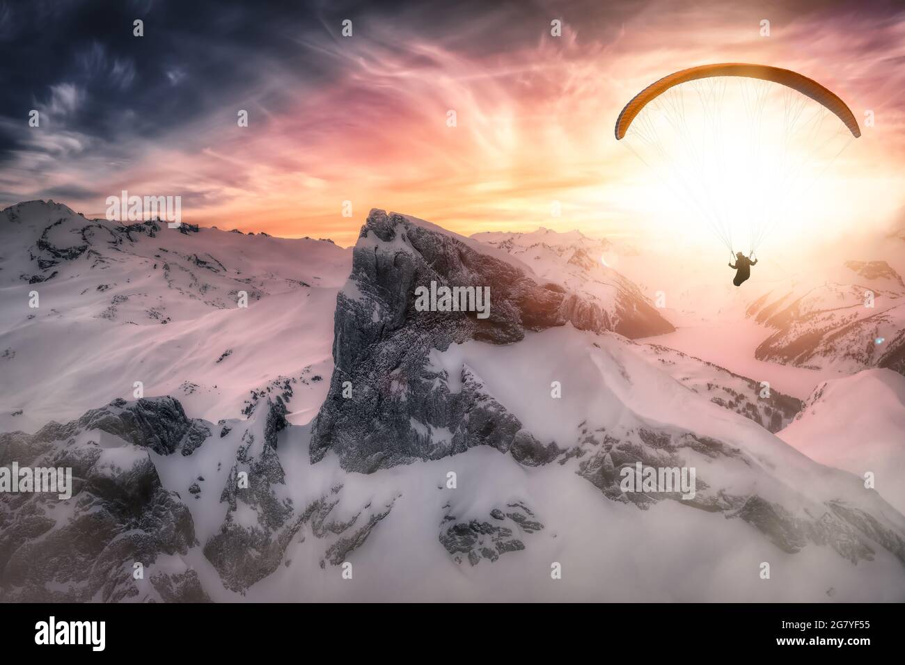 Adventure Composite Image of Paraglider Flying up high in the Rocky ...