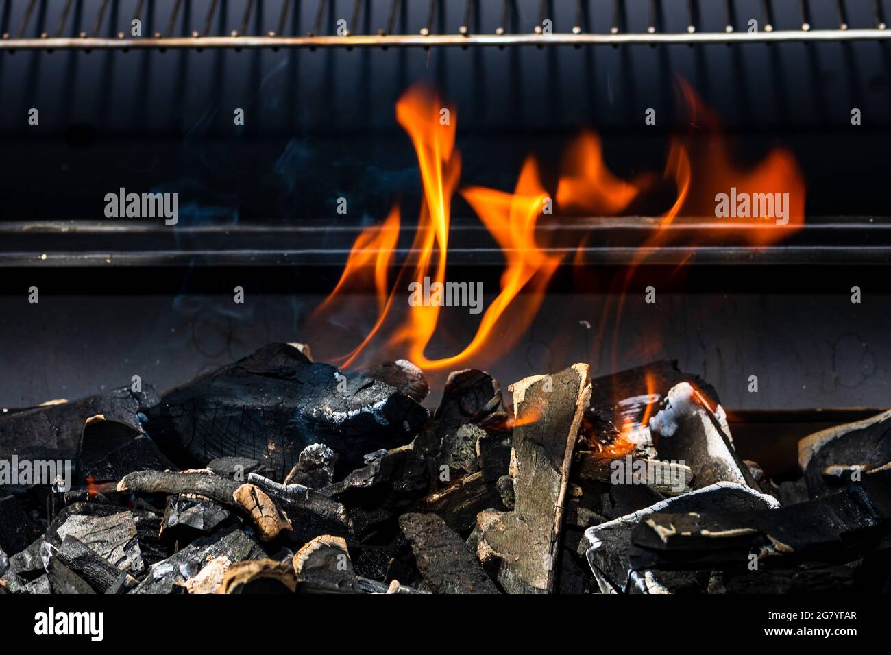 Barbecue grill pit with glowing and flaming hot open fire with red ...