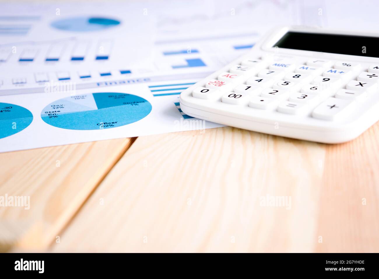 Calculator and charts Stock Photo - Alamy
