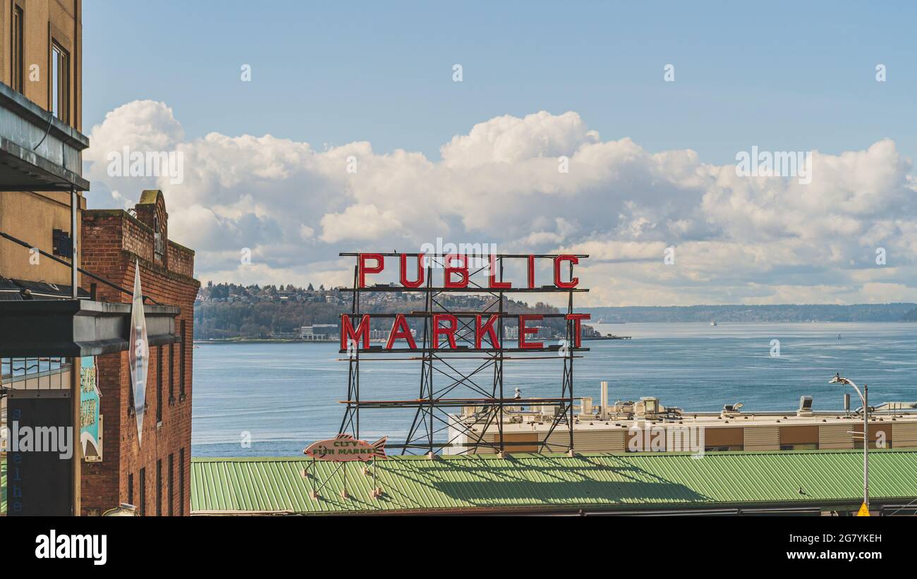 Pike Place Public Market sign against blue sky and clouds Stock Photo ...