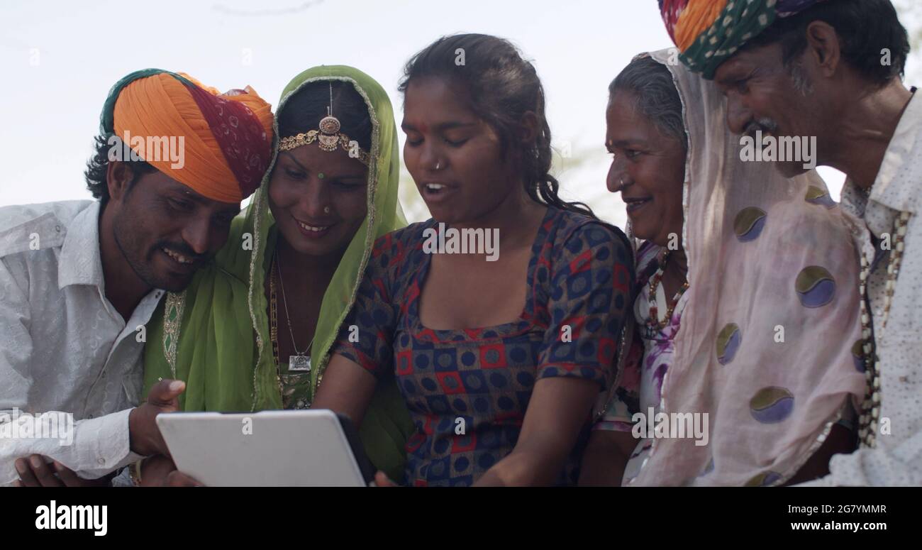 Indian family is chatting by video call Stock Photo - Alamy