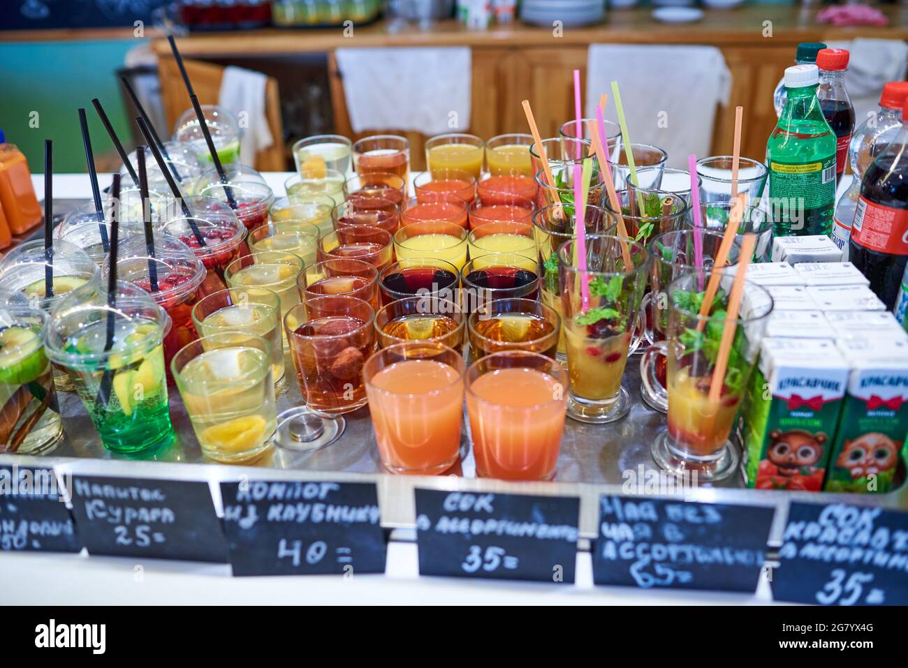 Assorted multi-colored drinks - lemonade, strawberry compote, juice ...