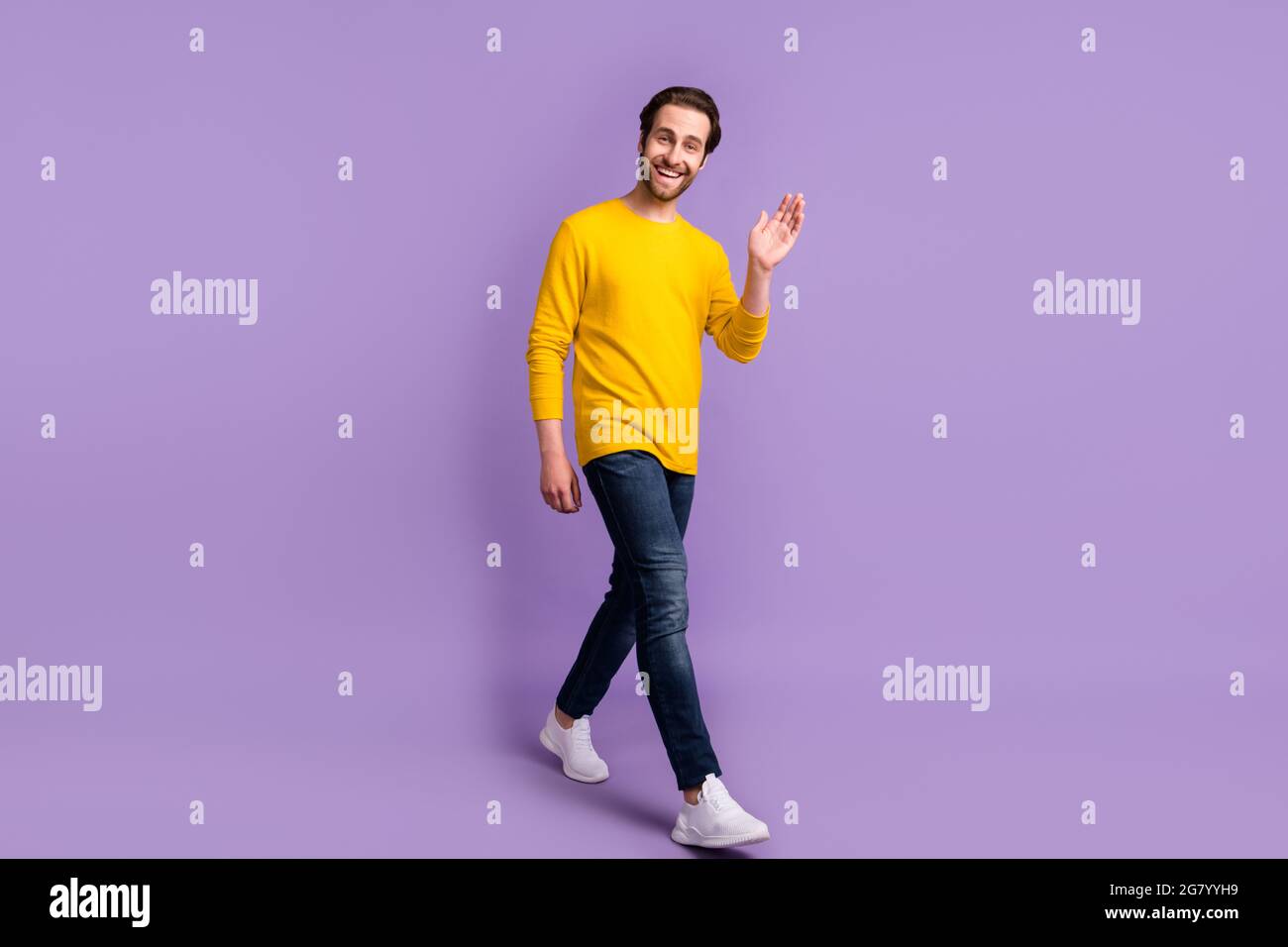 Full length body size view of attractive cheerful man going waving you ...