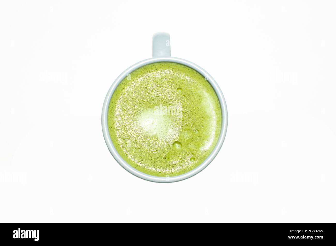 Matcha, green tea latte in a cup. white isolated background. Close up ...