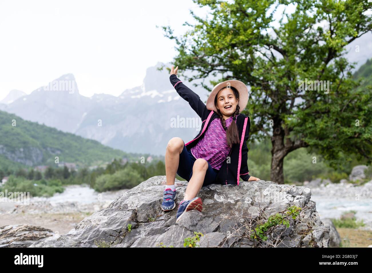 Portrait of a cute little girl in mountains Stock Photo - Alamy