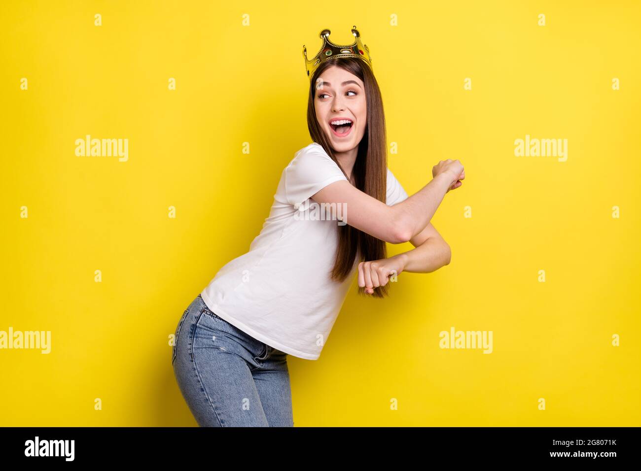 Portrait of attractive girlish cheerful girl wearing crown dancing rest ...