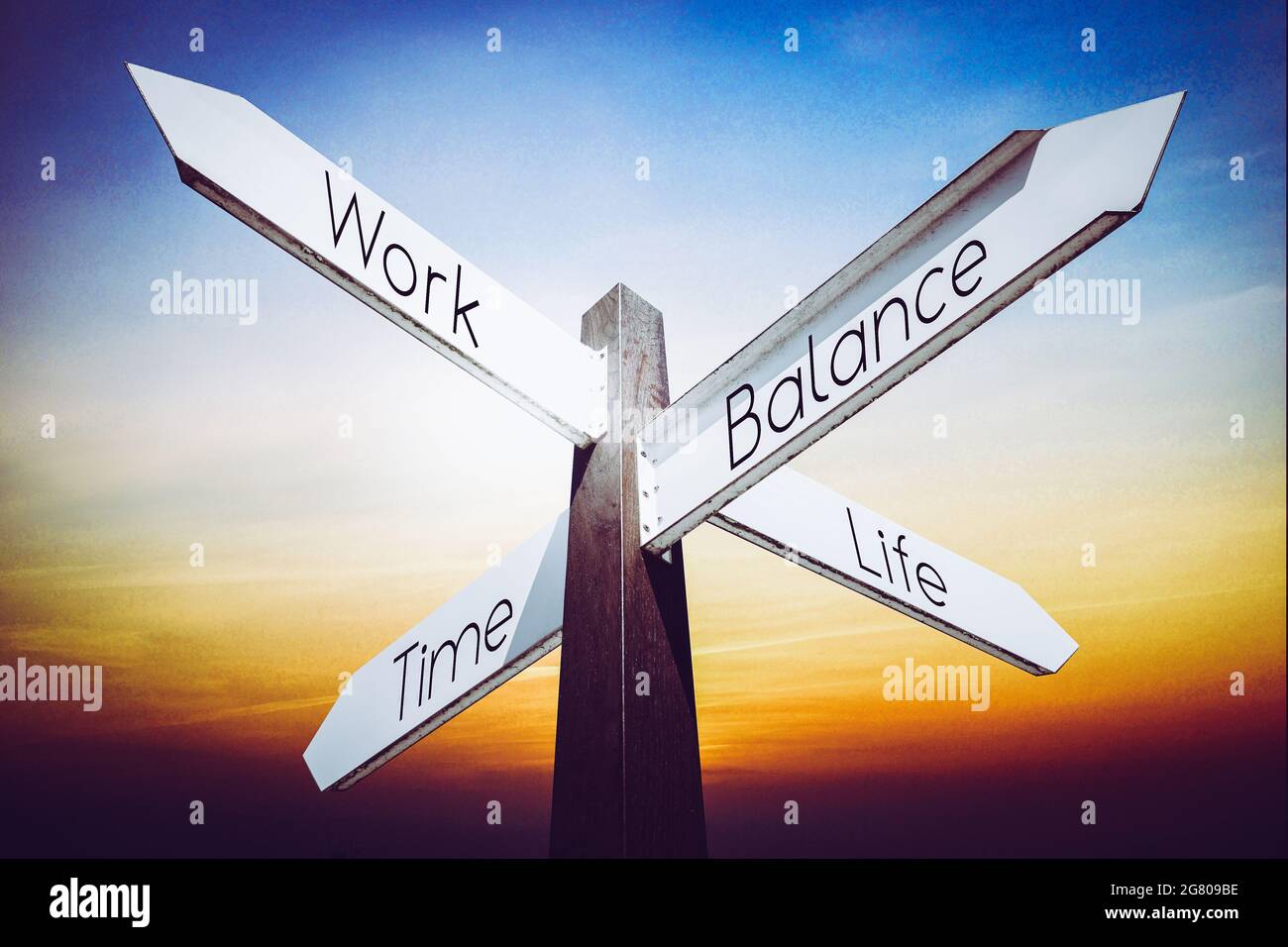 Work balance concept - signpost with four arrows Stock Photo - Alamy